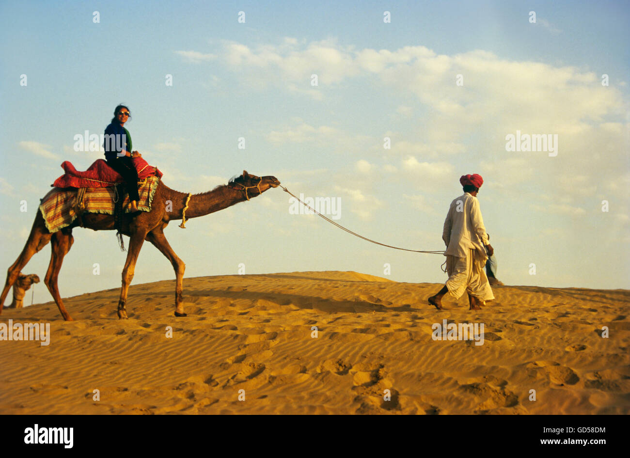 Woman riding a camel Stock Photo - Alamy