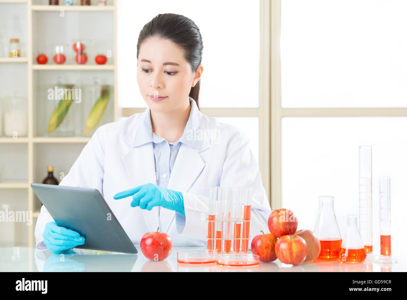Asian female scientist research for genetic modification food by ...