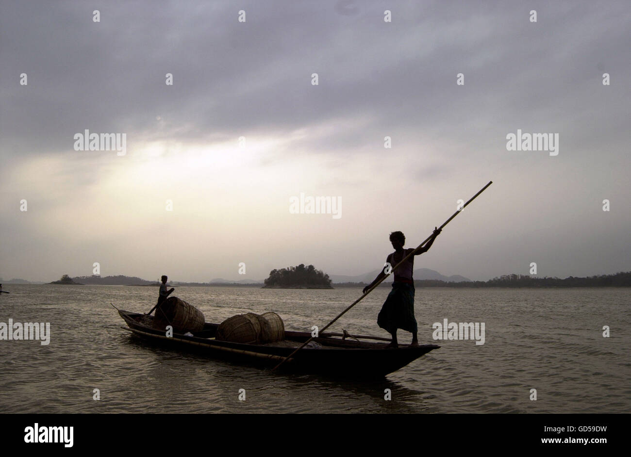 Men on boat during sunset Stock Photo - Alamy