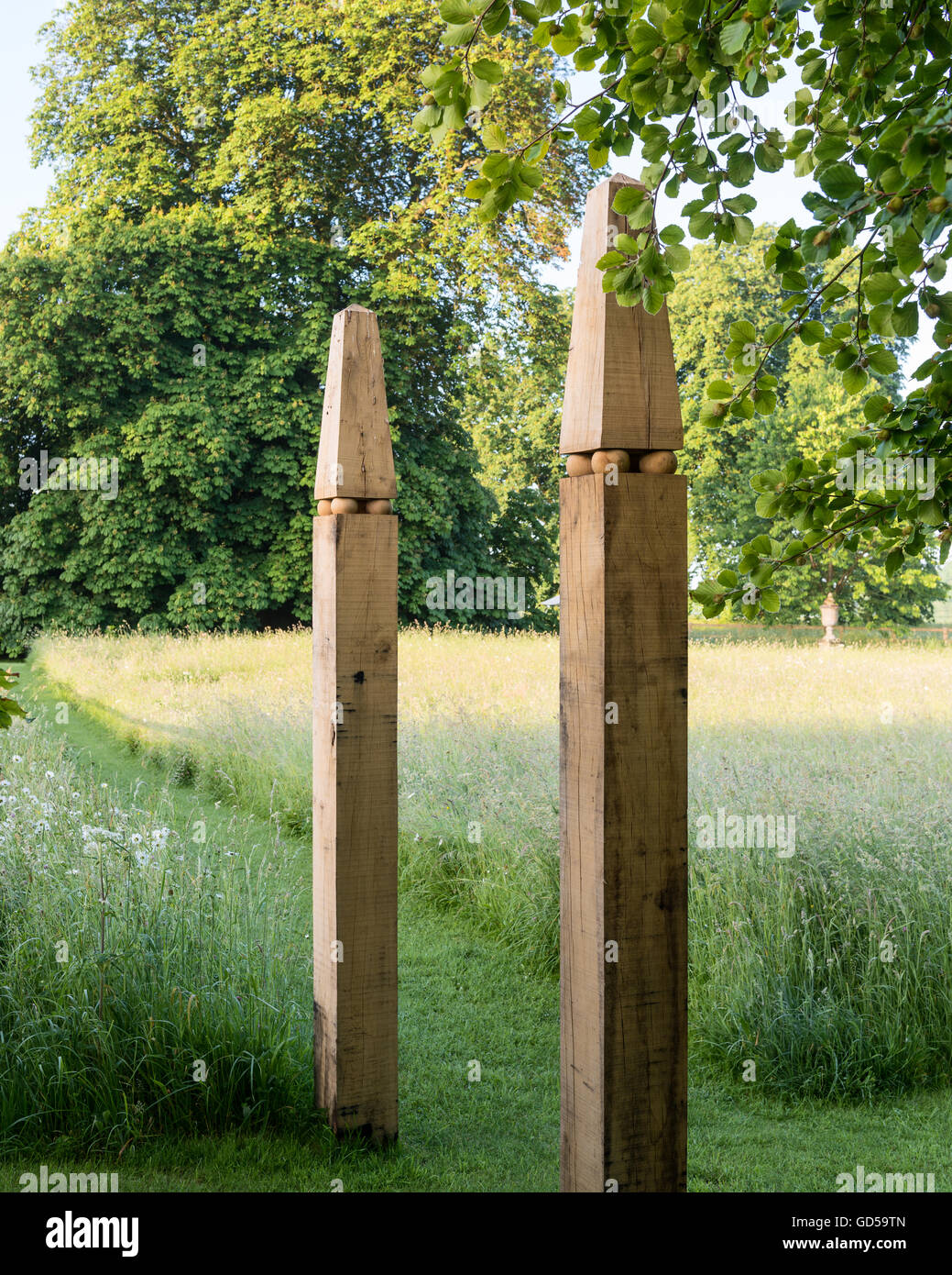 Oak posts in flower meadow Stock Photo - Alamy