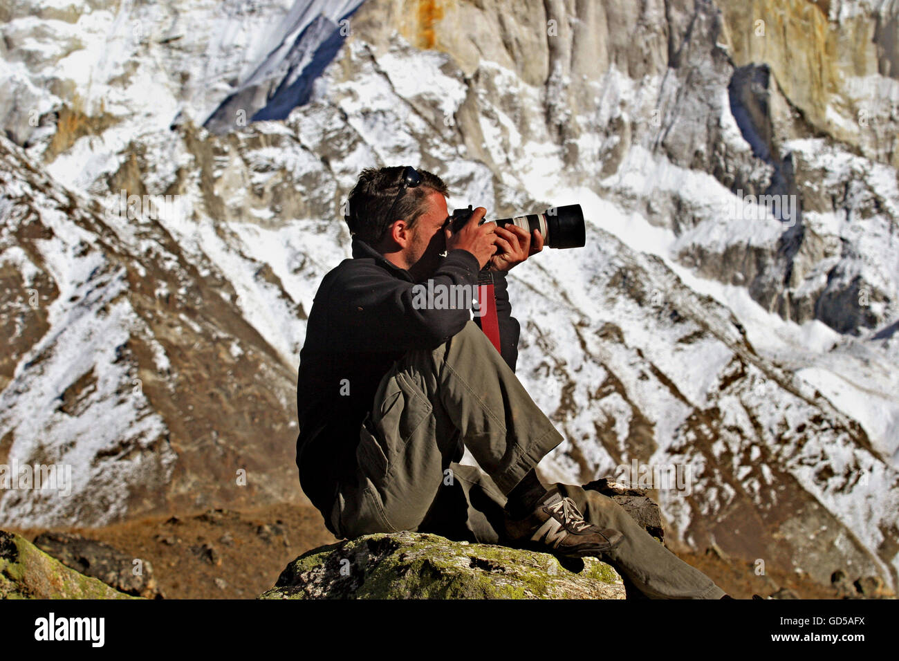 Photographer at work Stock Photo - Alamy