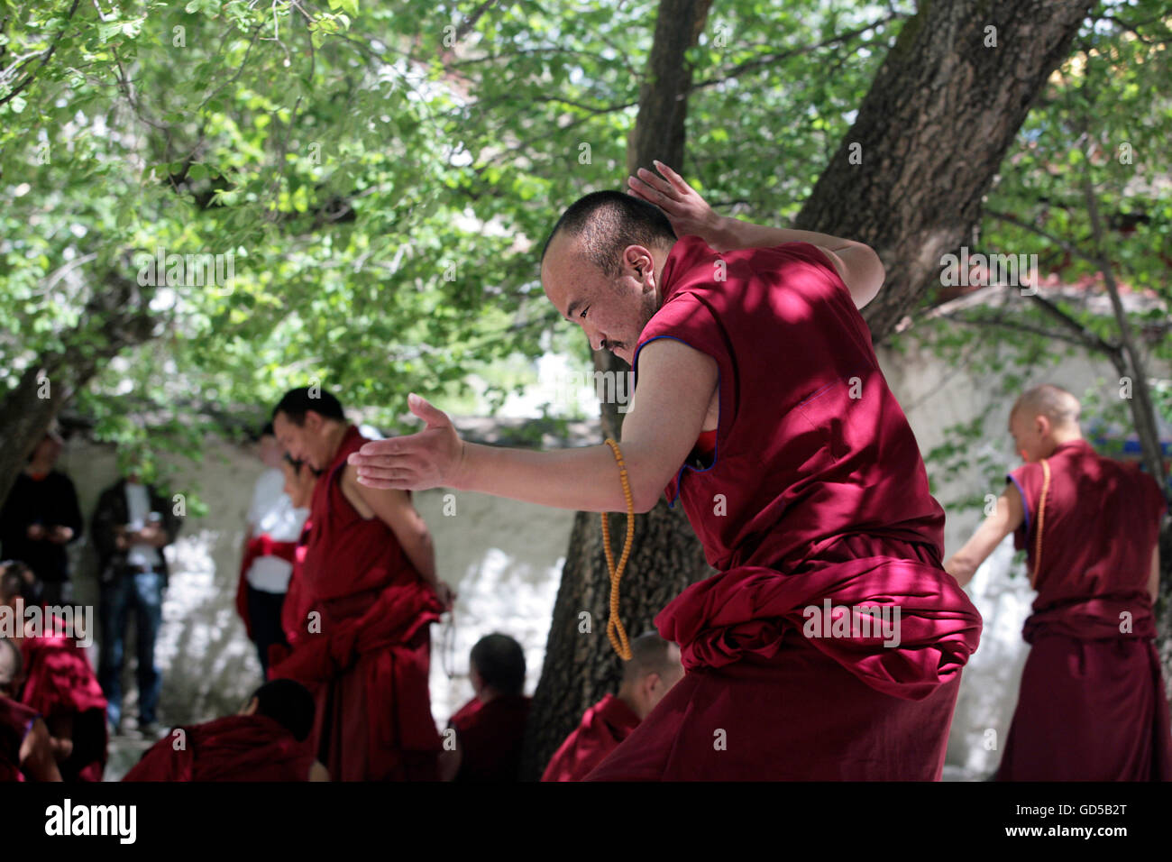 Tibetan monks talking hi-res stock photography and images - Alamy