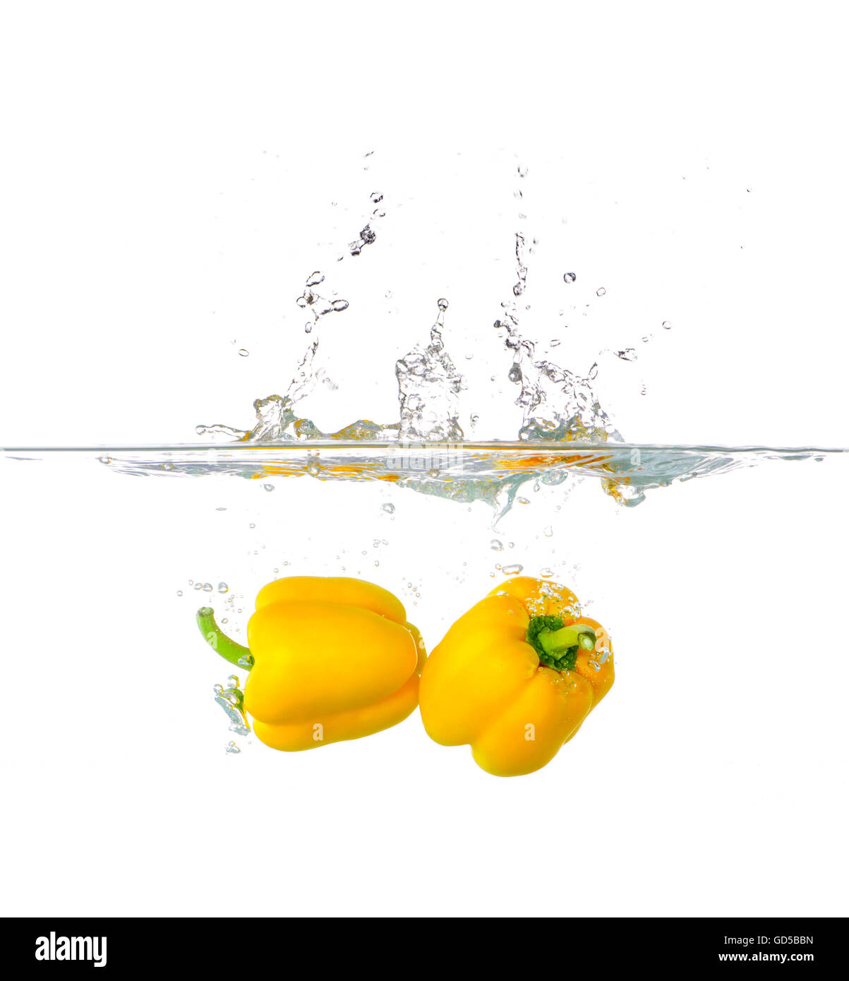 Two Yellow Paprika Splash in Water Isolated on White Background Stock ...