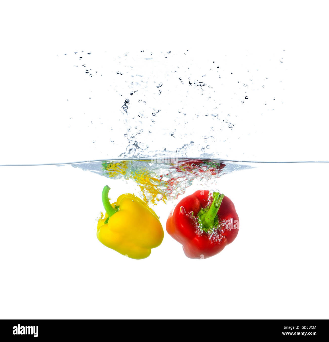 Fresh Red and Yellow Paprika Splashing in Water Isolated on White ...