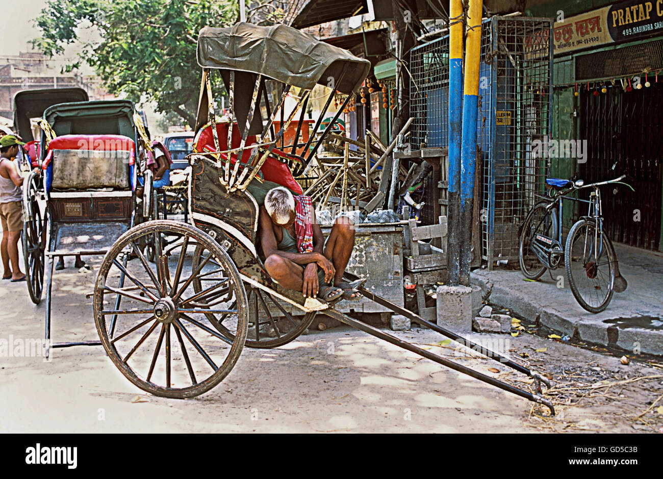 Hand rickshaw with puller hi-res stock photography and images - Alamy