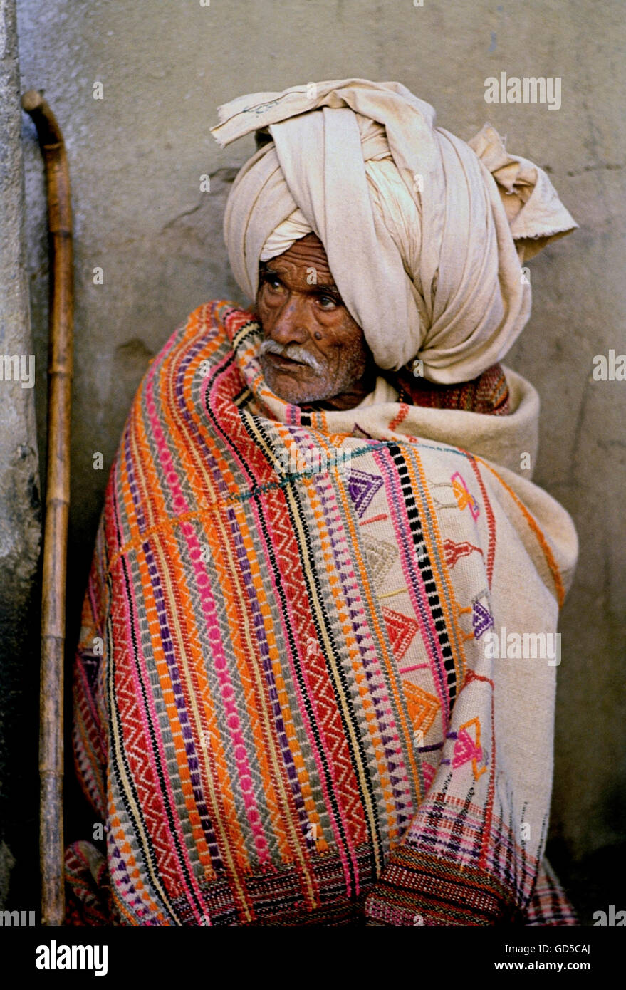 Old man wrapped in blanket Stock Photo - Alamy