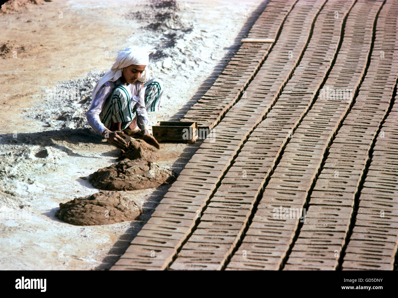 Labourer in brick factory Stock Photo - Alamy