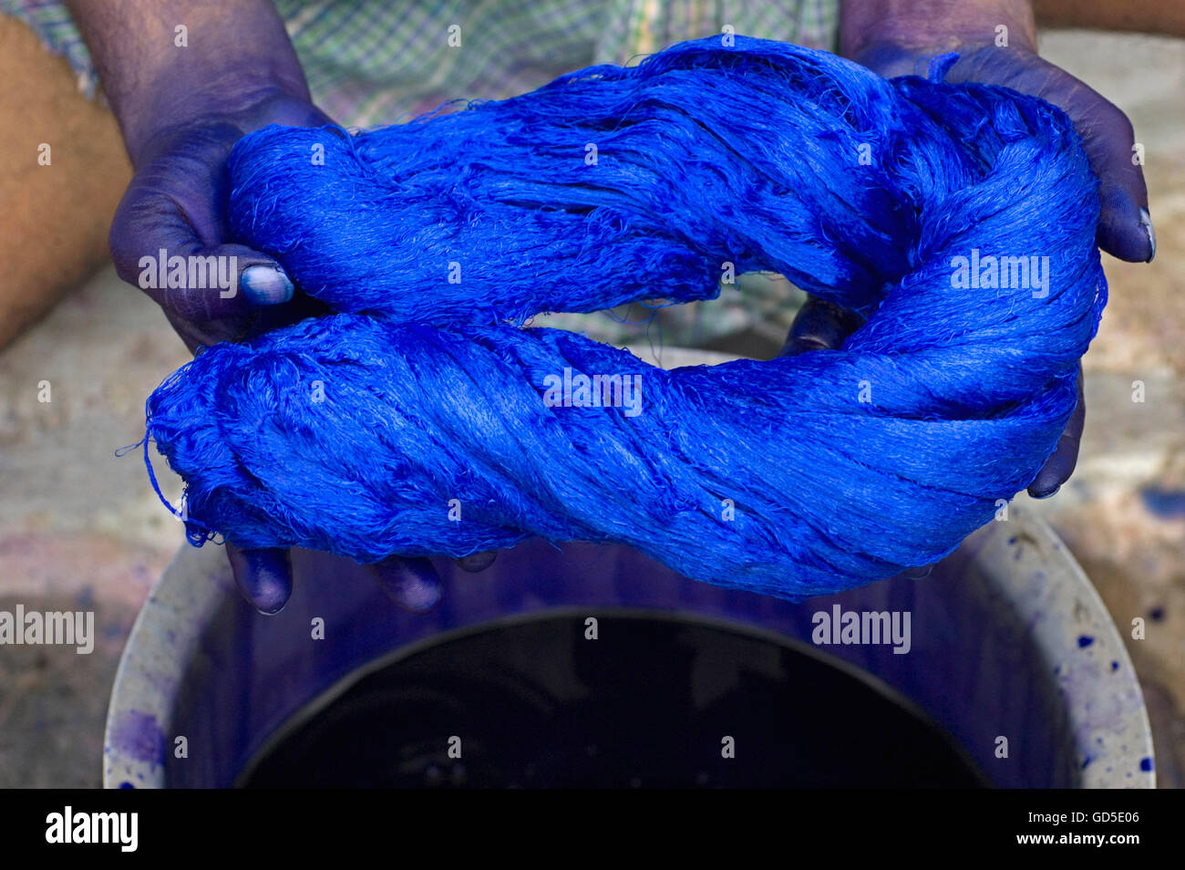 Weaver dyeing the silk yarn Stock Photo - Alamy