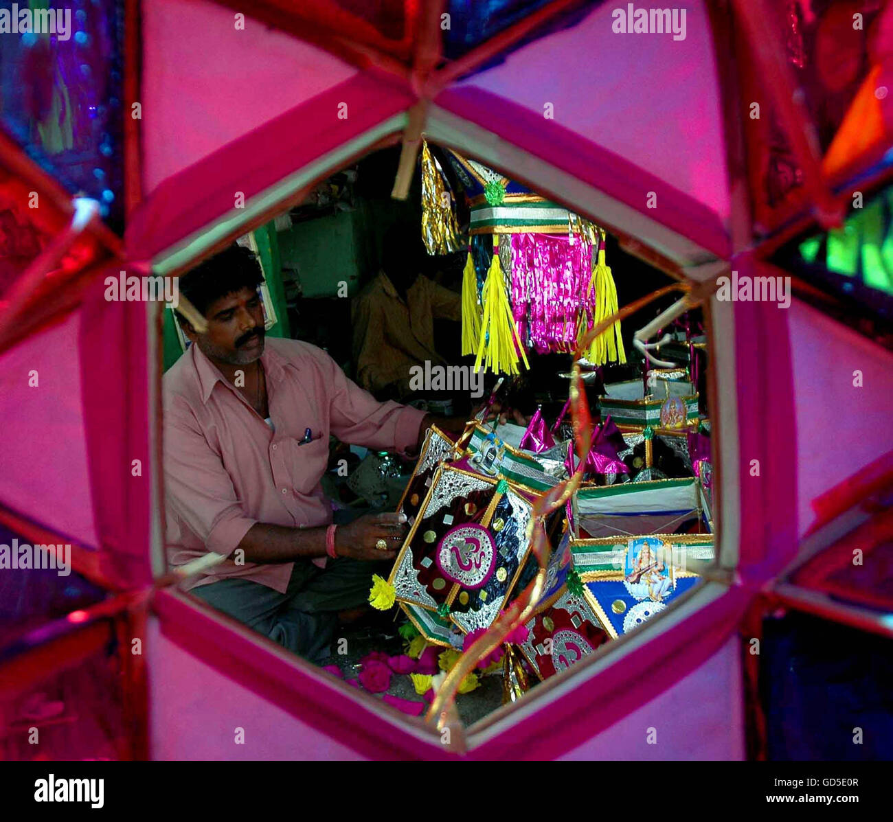 Man making paper lanterns Stock Photo - Alamy