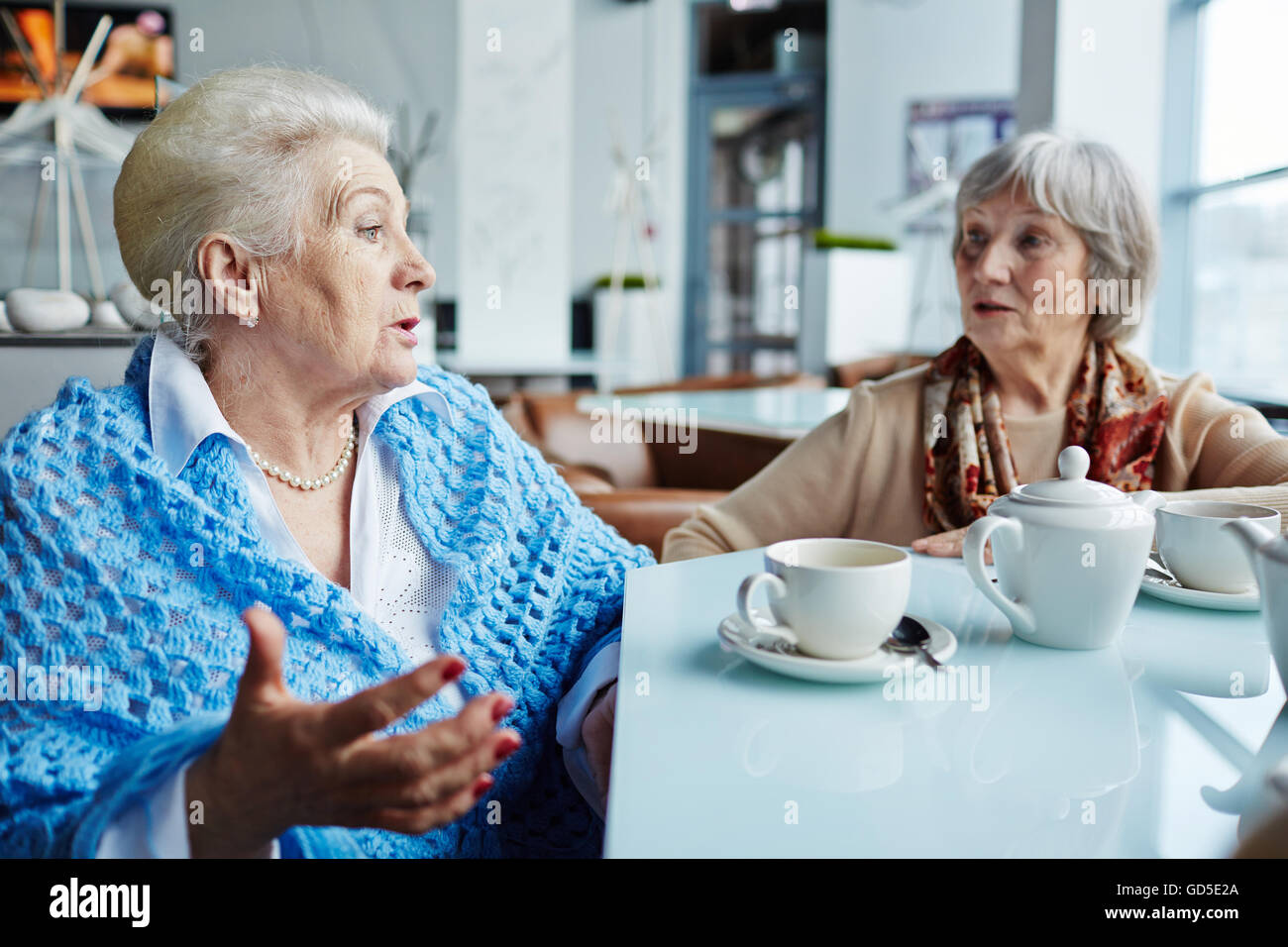 Talk by cup of tea Stock Photo - Alamy