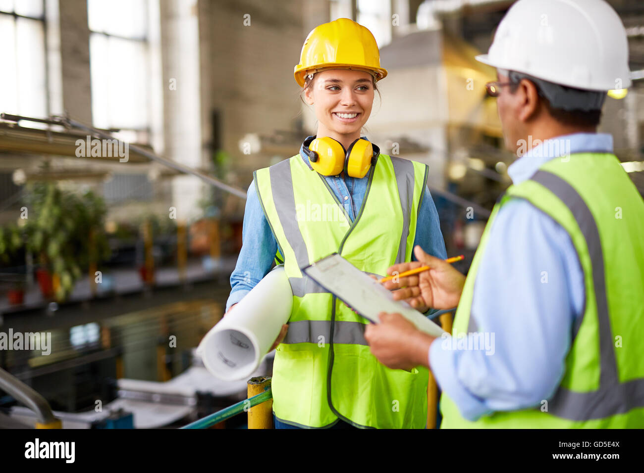 Talking to foreman Stock Photo - Alamy