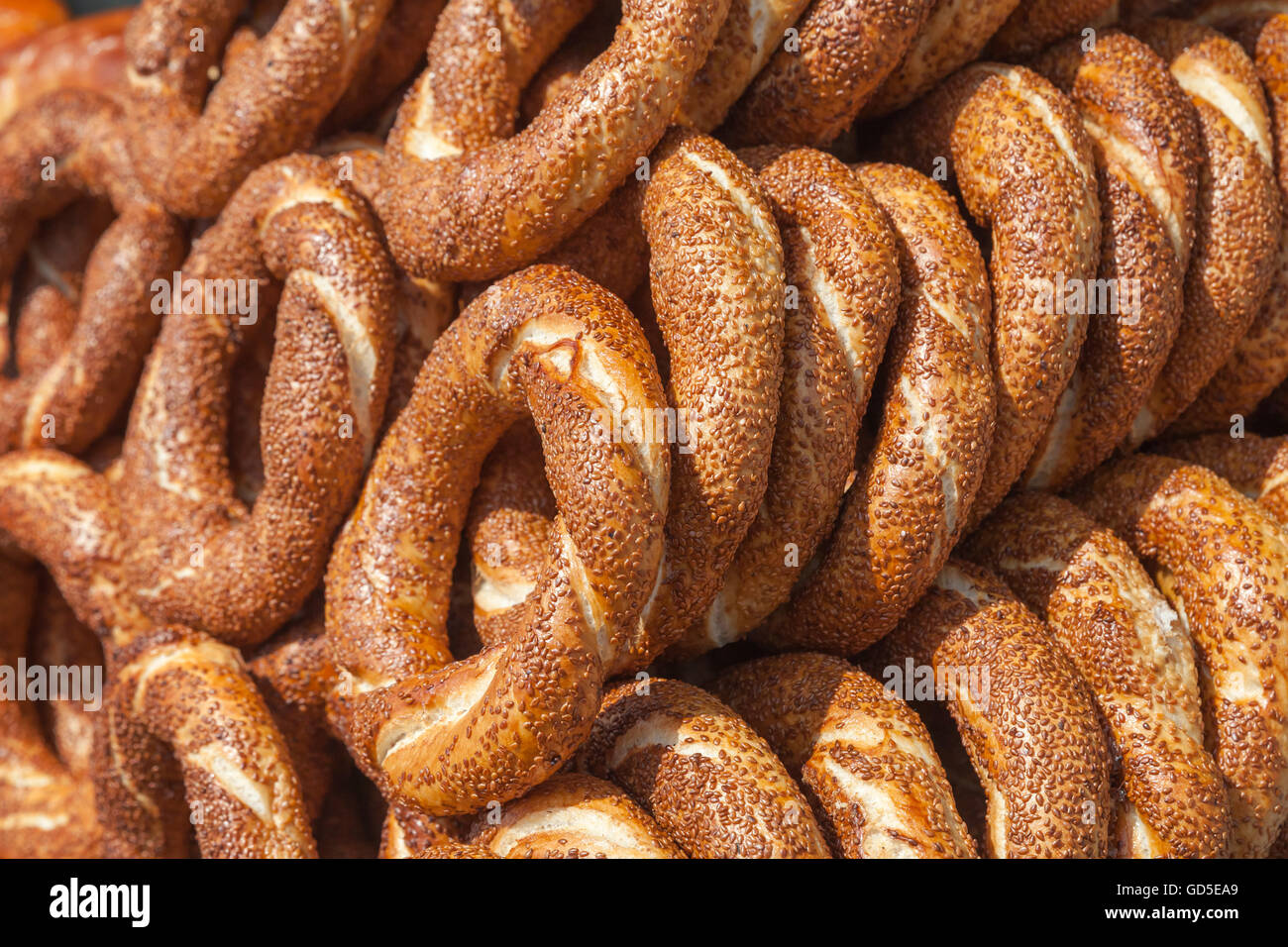Simit is a circular bread, typically encrusted with sesame seeds ...