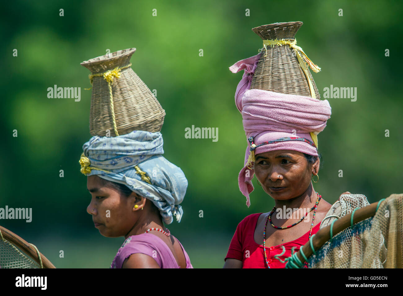 Tharu woman in nepali terai wearing traditional clothing to go fishing ...
