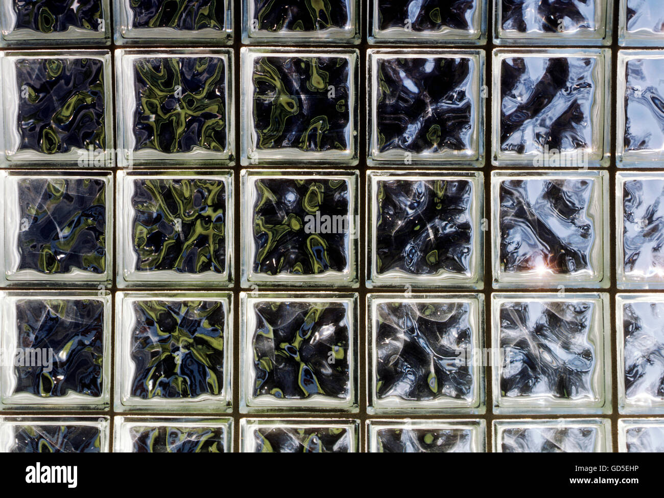Sun streaming through block glass wall in a stairwell, American College ...