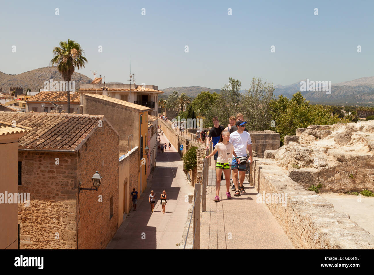 People walking the old town walls, Alcudia, Mallorca, ( Majorca ...