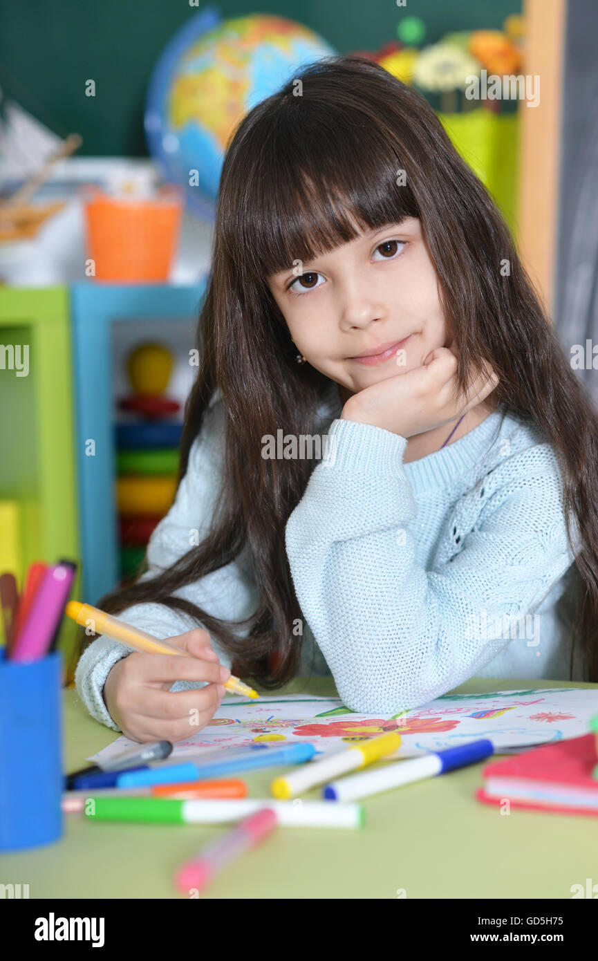 Little girl drawing at class Stock Photo - Alamy