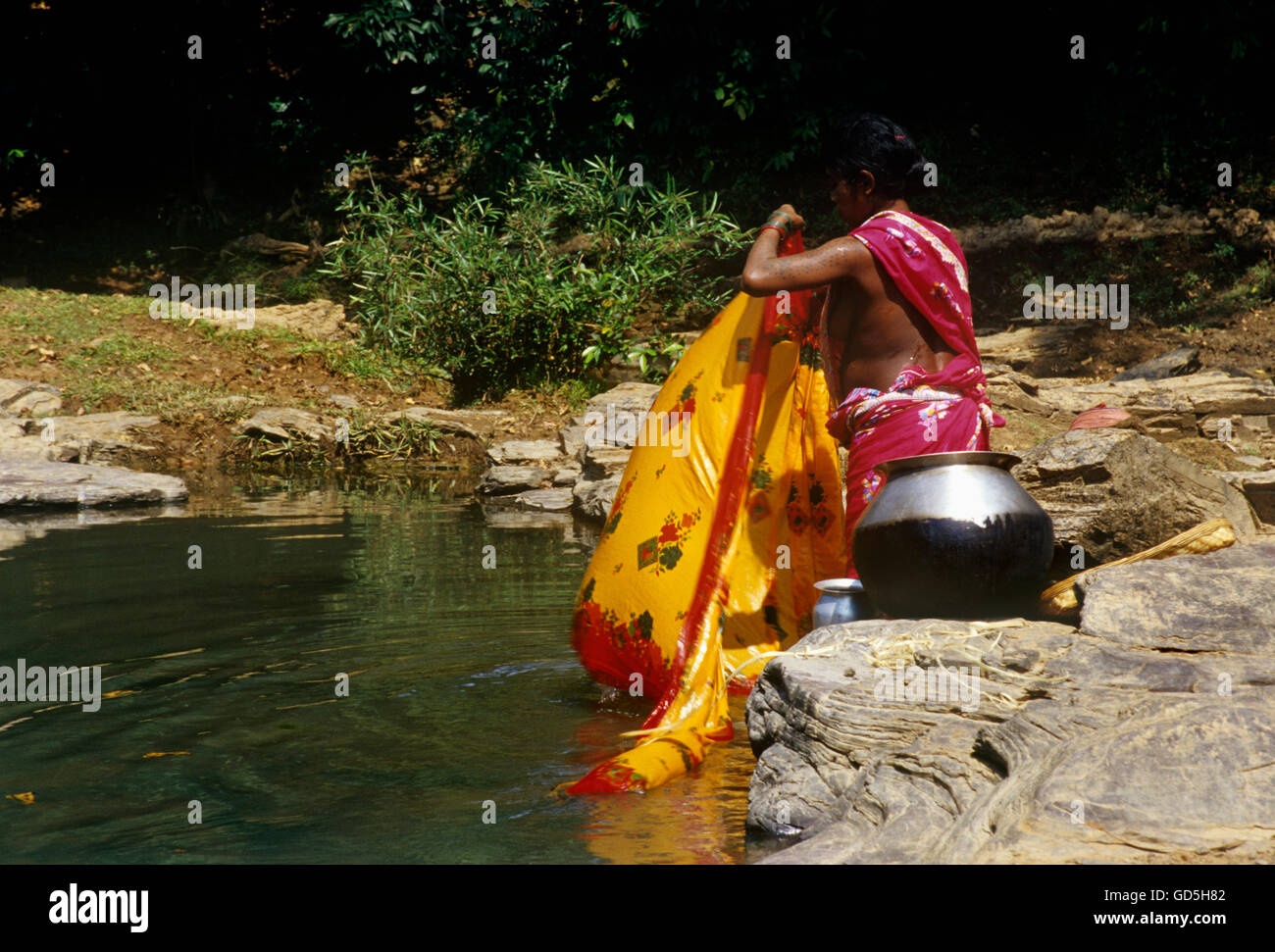 Woman washing clothes Stock Photo - Alamy