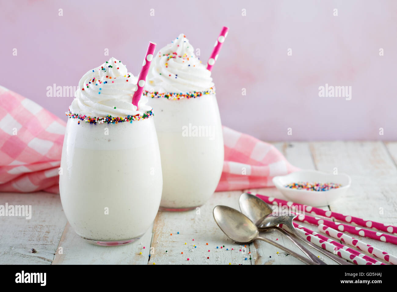 Vanilla milkshake with whipped cream and sprinkles Stock Photo - Alamy