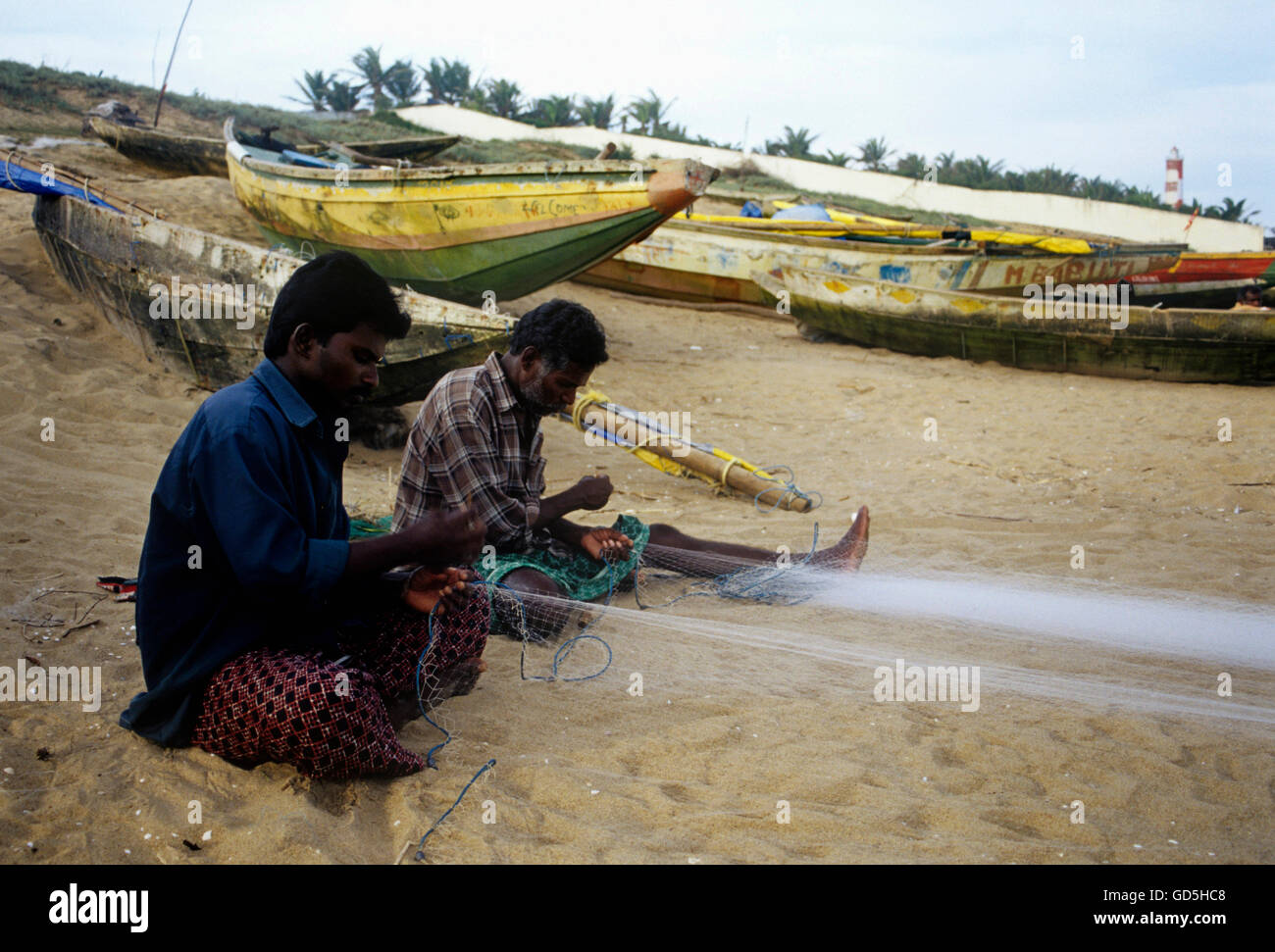 Fishermen making nets Stock Photo - Alamy