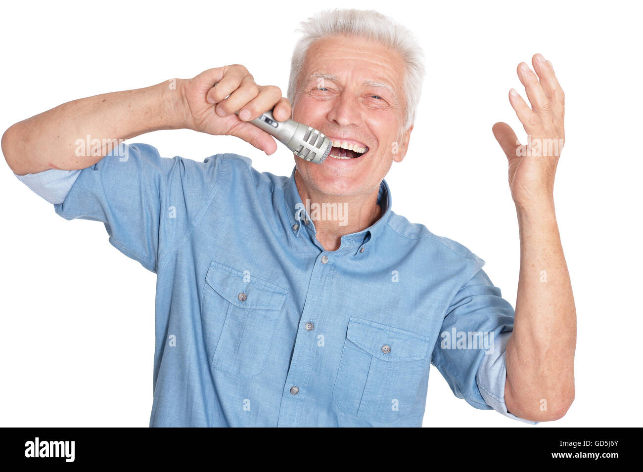 Senior man singing into microphone Stock Photo - Alamy