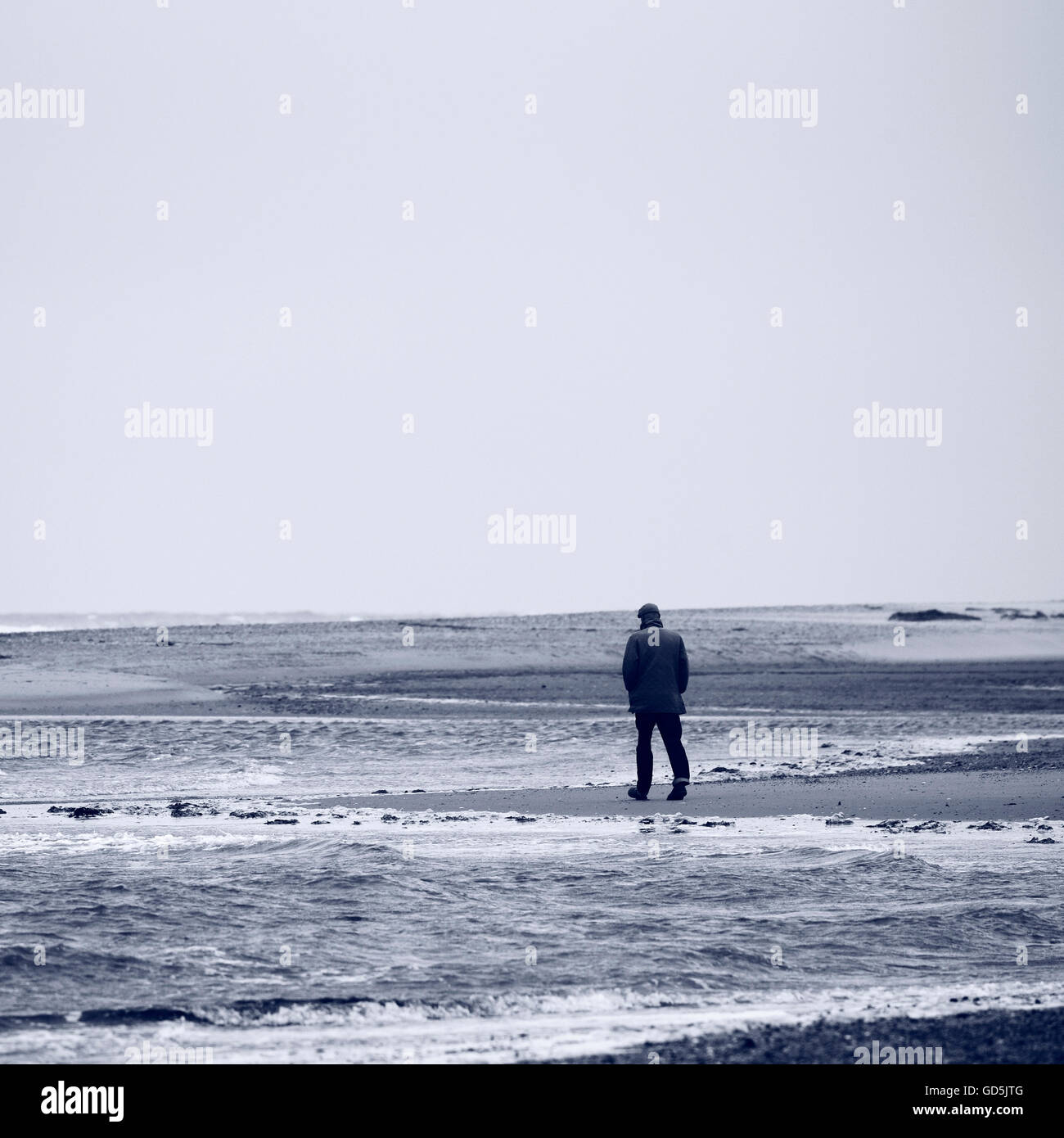 Man walking beach alone hi-res stock photography and images - Alamy