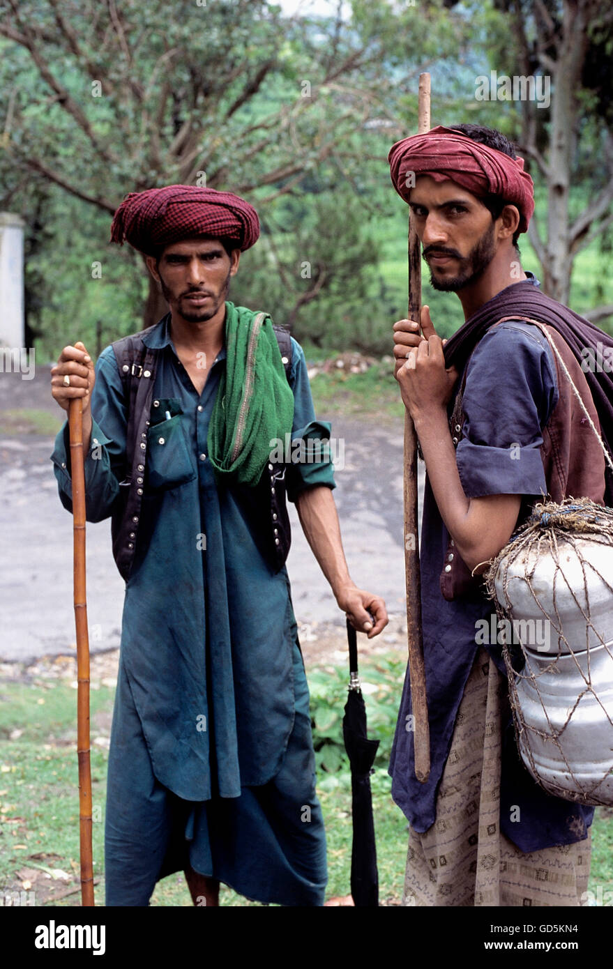 Two men carrying sticks hi-res stock photography and images - Alamy