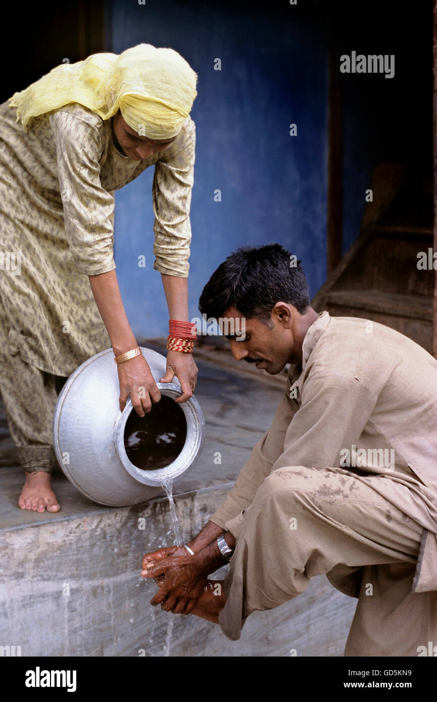 Man cleaning his legs Stock Photo - Alamy