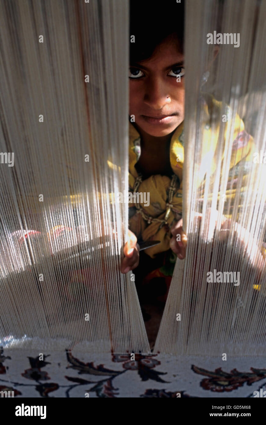 Child weaving on hand loom Stock Photo - Alamy
