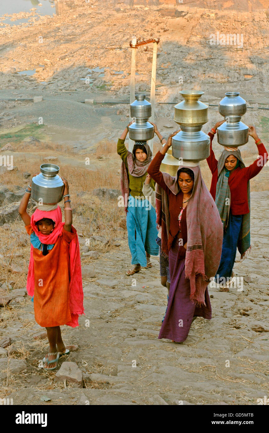 Rural lady carrying water hi-res stock photography and images - Alamy