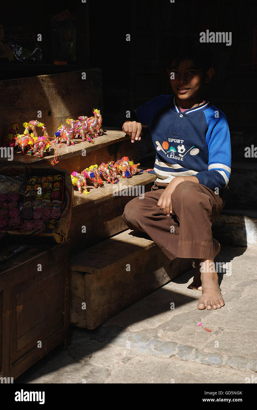 A child selling articles Stock Photo - Alamy