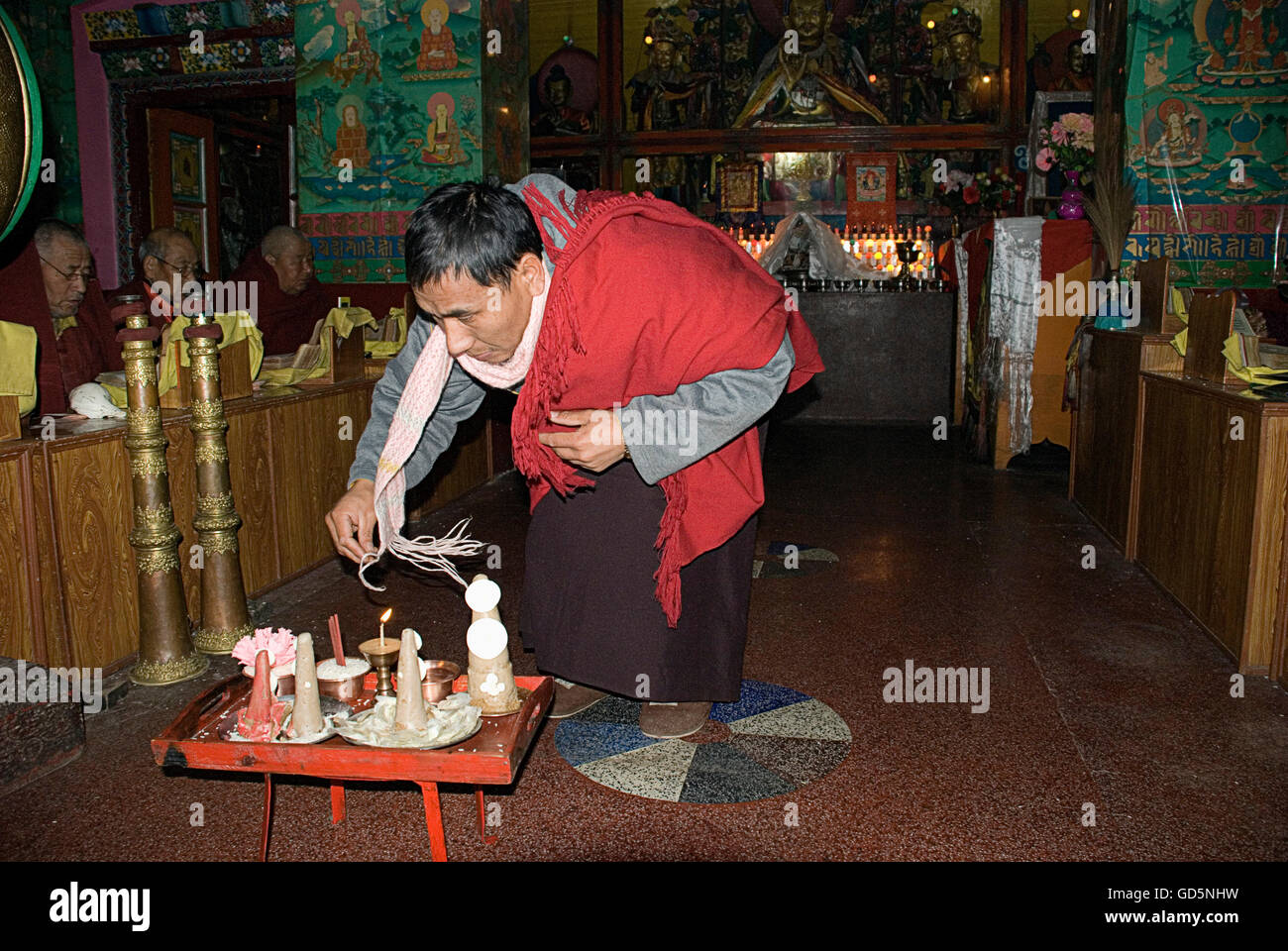 Monk offering prayers Stock Photo - Alamy