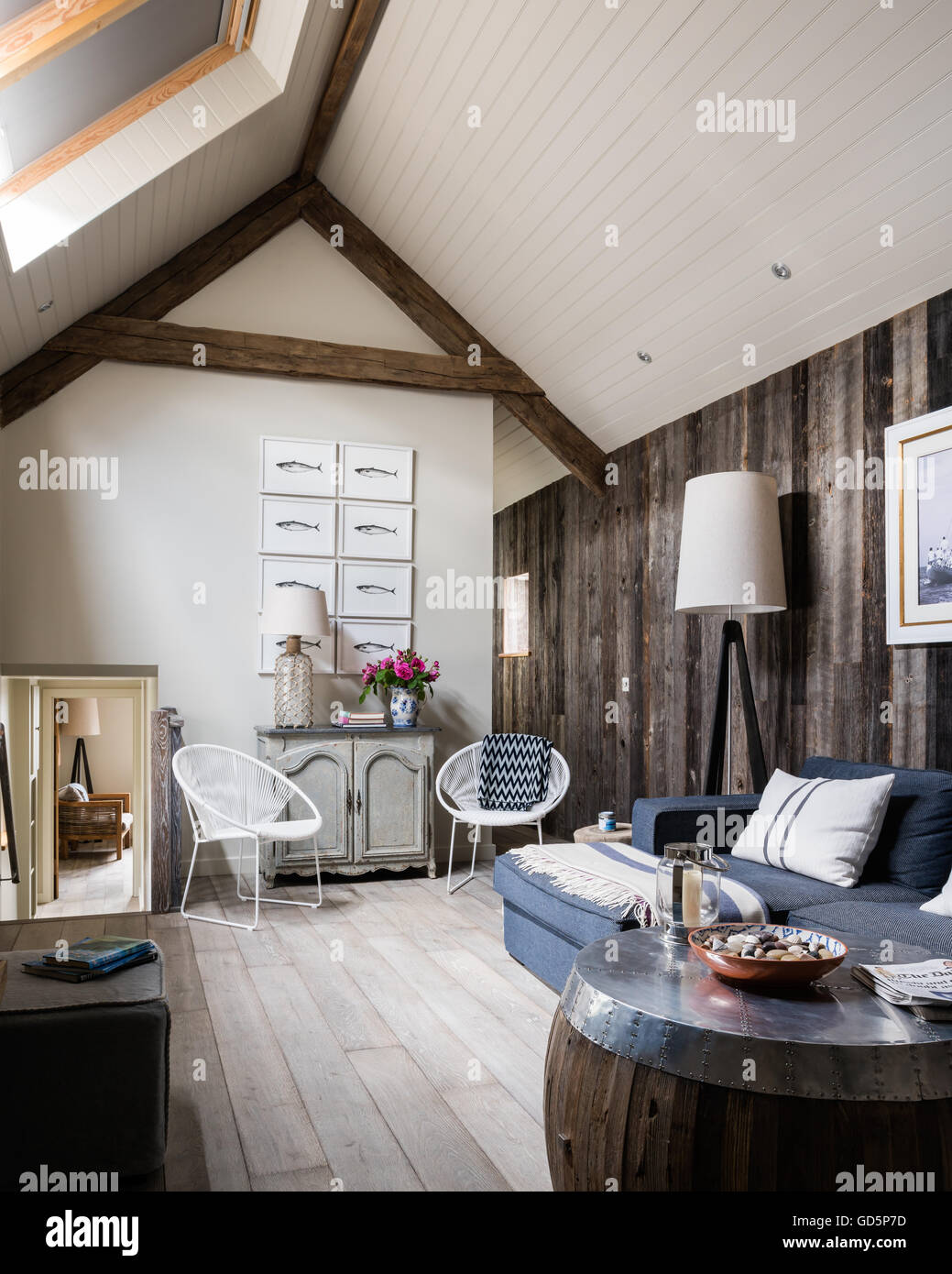 Grey modular seating from Iroka in sitting room with wood panelled ...