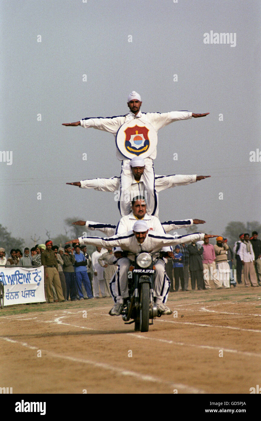 Stuntmen performing at rural Olympics Stock Photo - Alamy