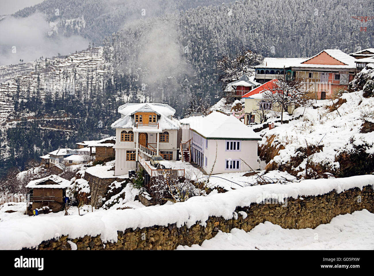 Snowfall in a village Stock Photo - Alamy