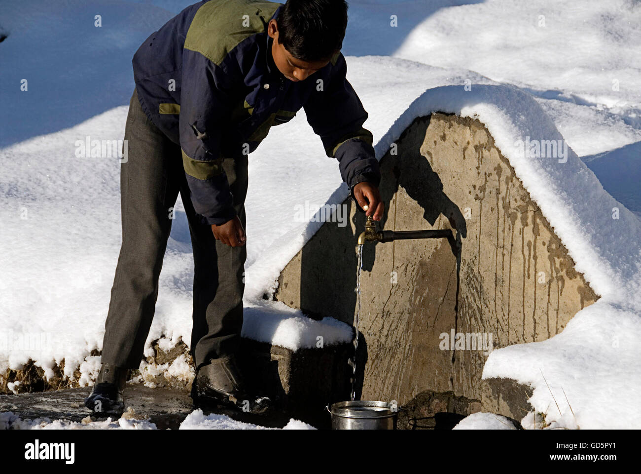 Filling water from a tap Stock Photo - Alamy