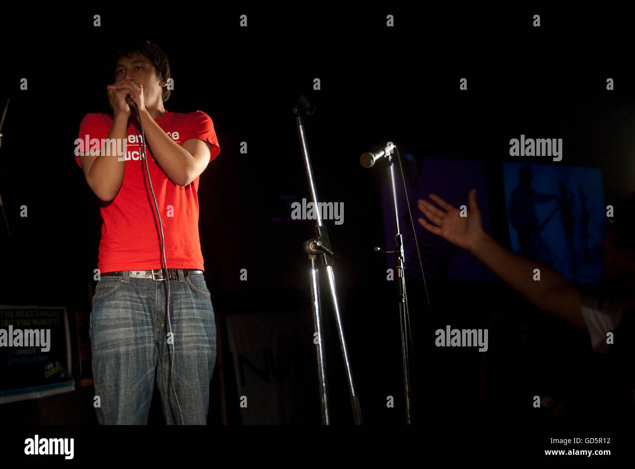 Singer performing on stage Stock Photo - Alamy