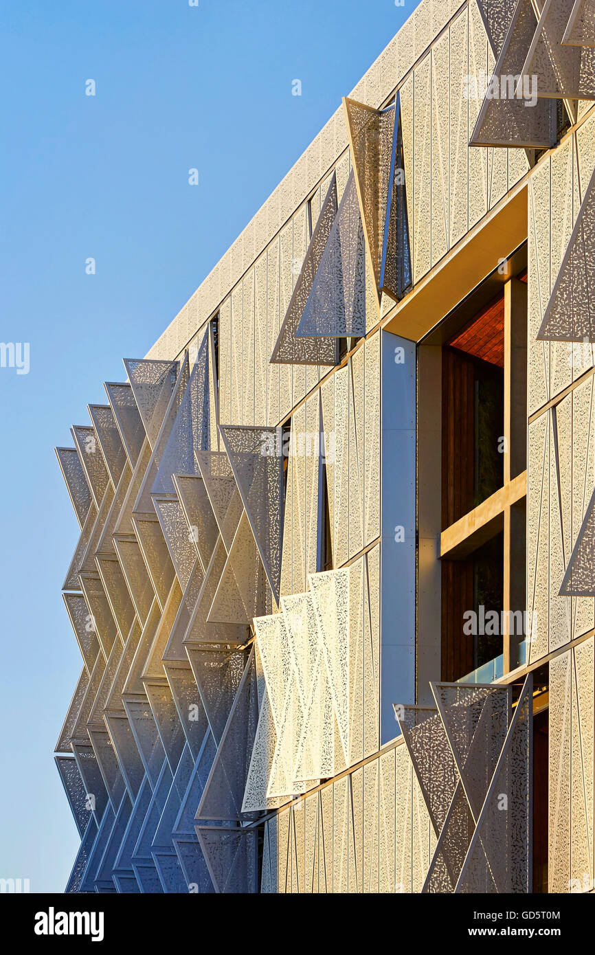 Exterior facade with adjustable triangular perforated steel shutters ...