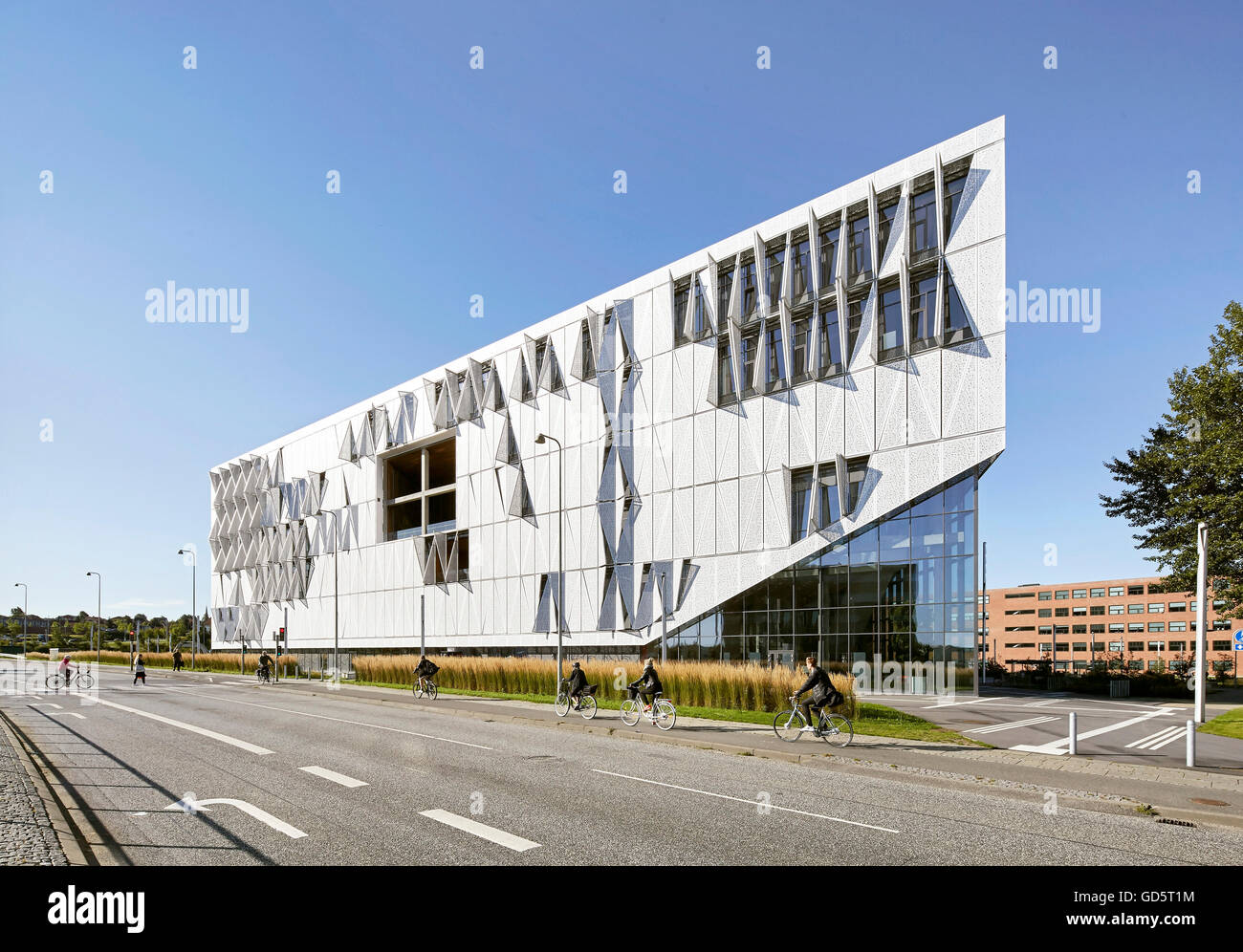 Building perspective with street and bicyclists. SDU Campus Kolding ...