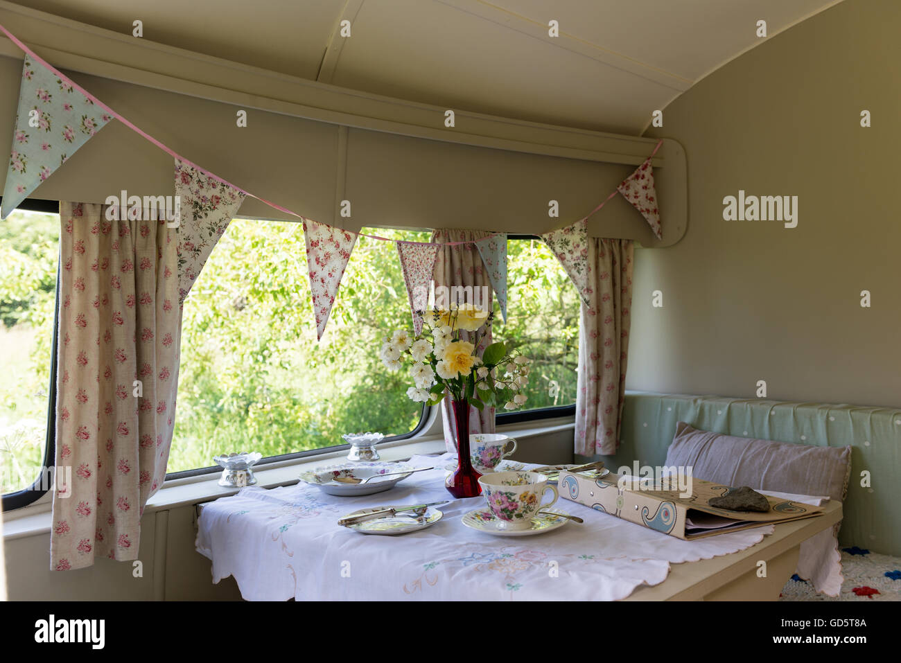 Seating area inside a caravan with retro interior Stock Photo - Alamy
