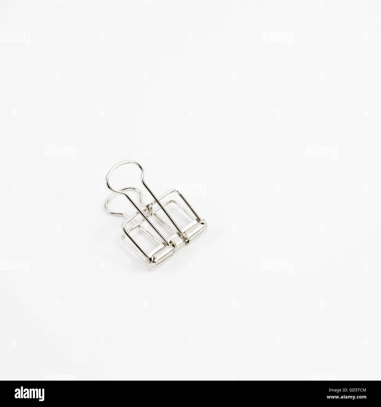 The silver binder clip (paper clip stationery Stock Photo - Alamy