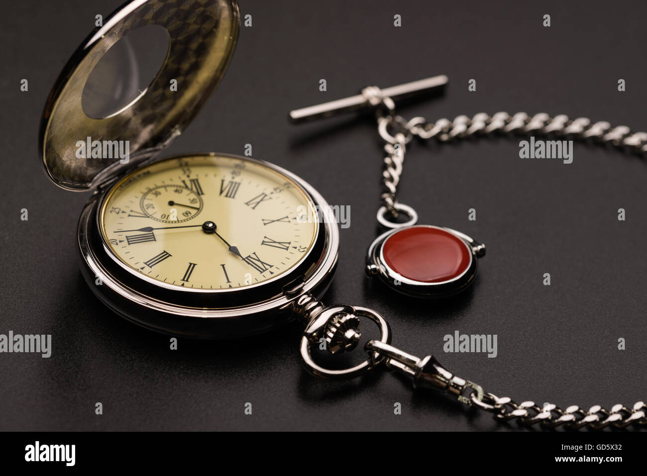 Stylish retro pocket watch on black Stock Photo - Alamy