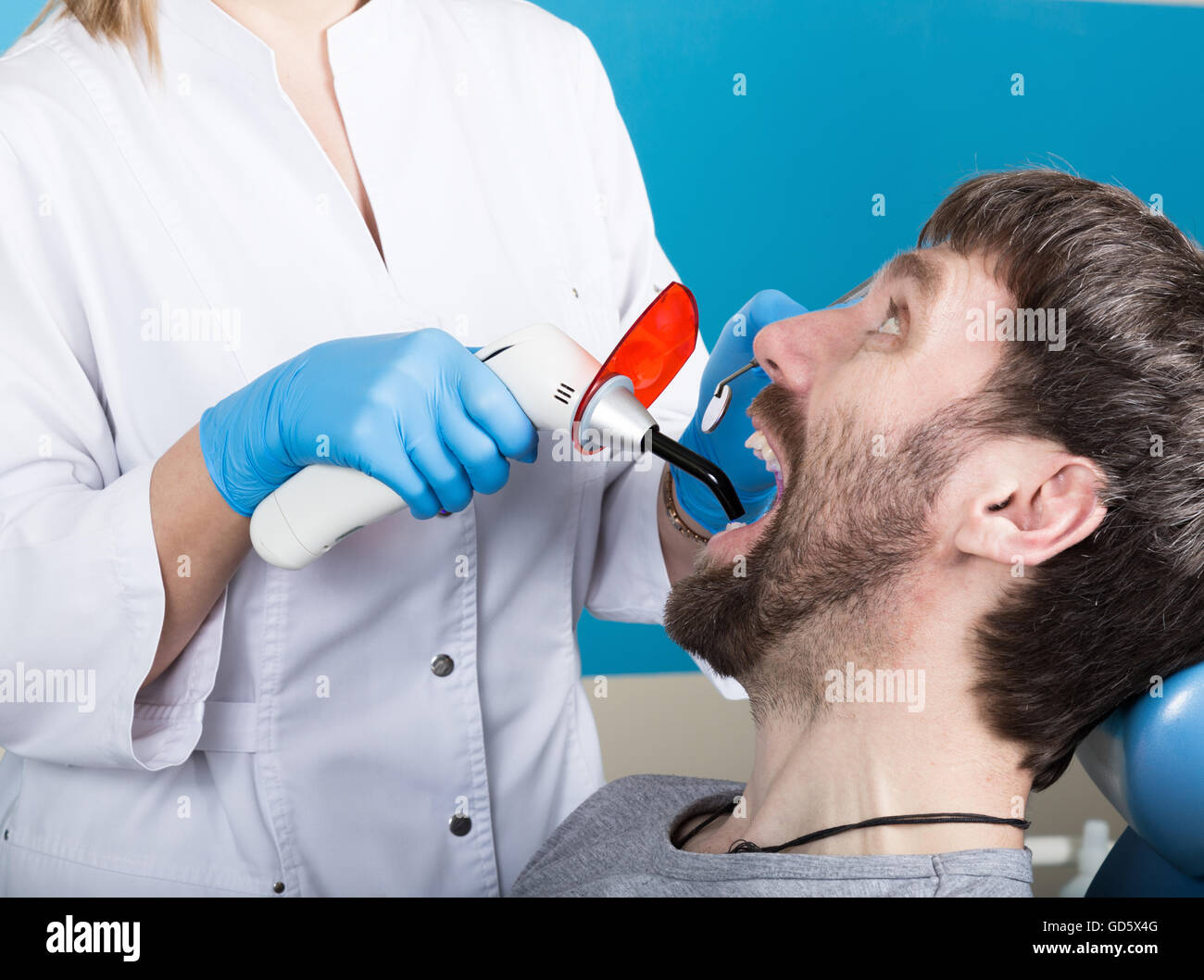 Doctor examines the oral cavity on tooth decay. Caries protection ...