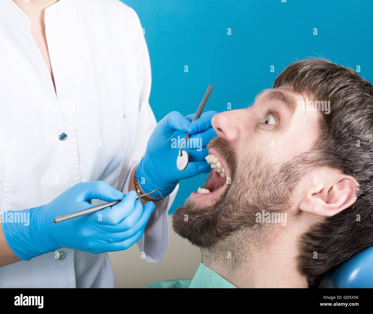 Doctor examines the oral cavity on tooth decay. Caries protection ...