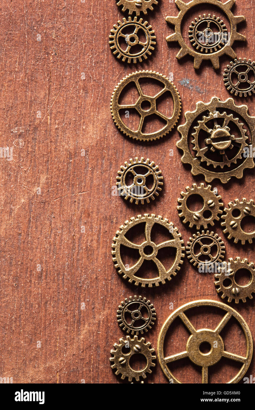 steampunk mechanical cogs gears wheels on wooden background Stock Photo ...
