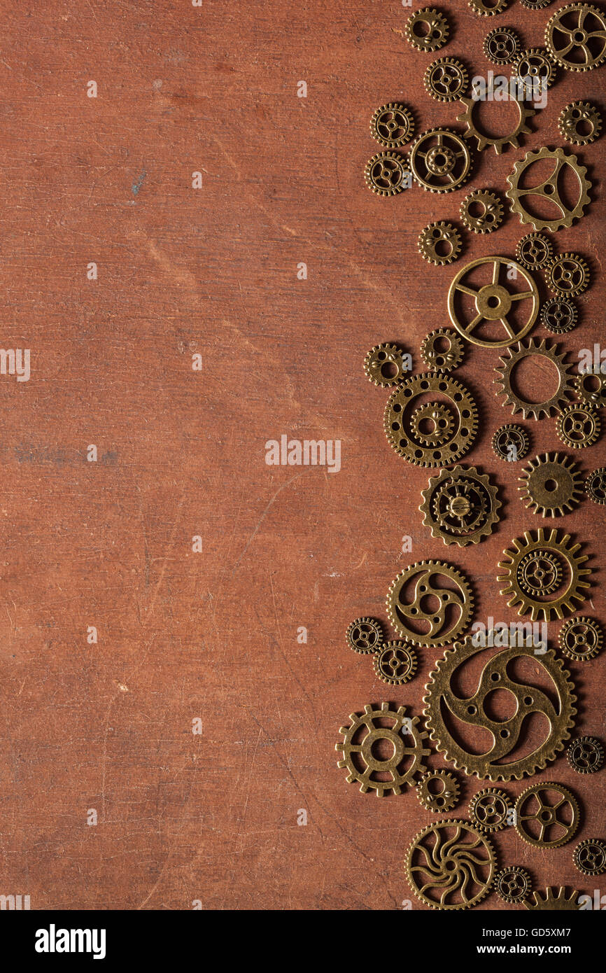 steampunk mechanical cogs gears wheels on wooden background Stock Photo ...