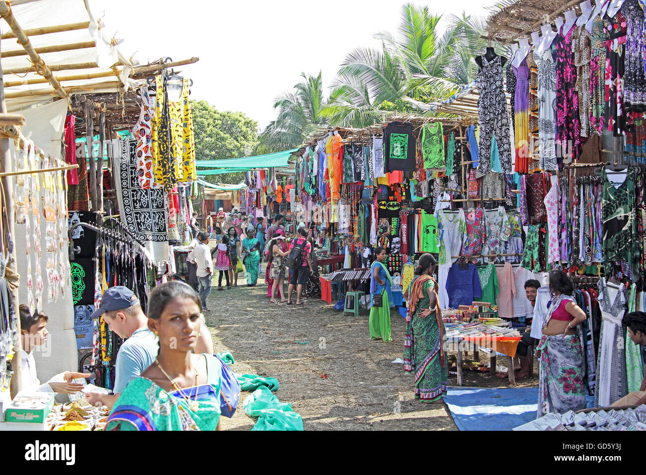Shops and customers at the Wednesday flea market in Anjuna Beach, Goa ...