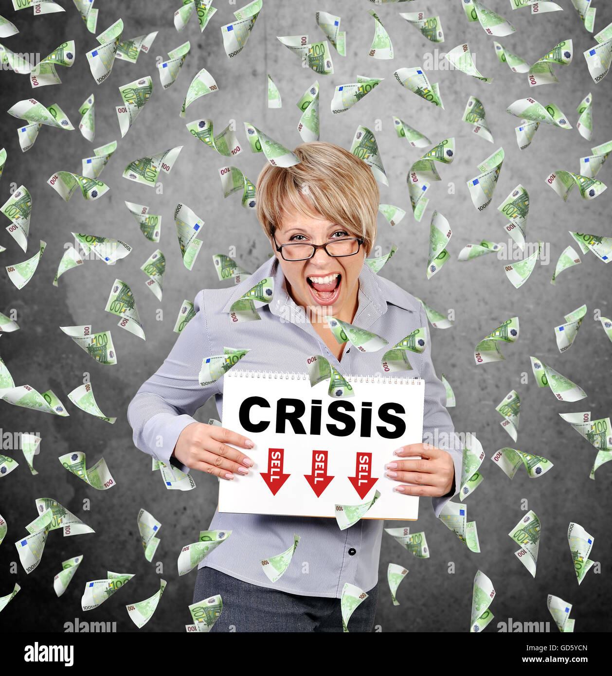 angry woman holding poster with drawing crisis symbol and falling euro ...