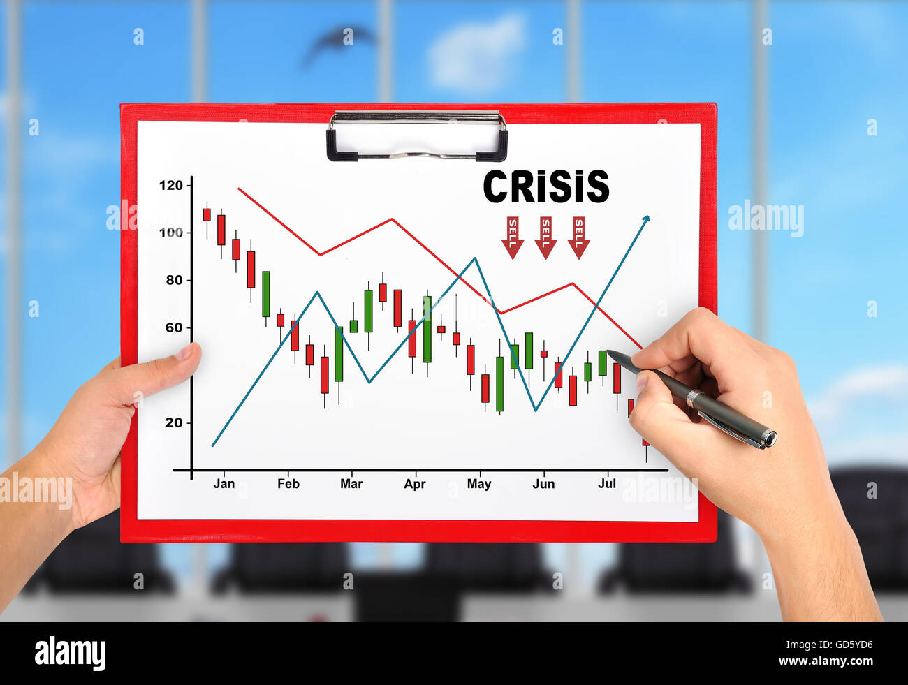 hands drawing crisis chart in red clipboard Stock Photo - Alamy
