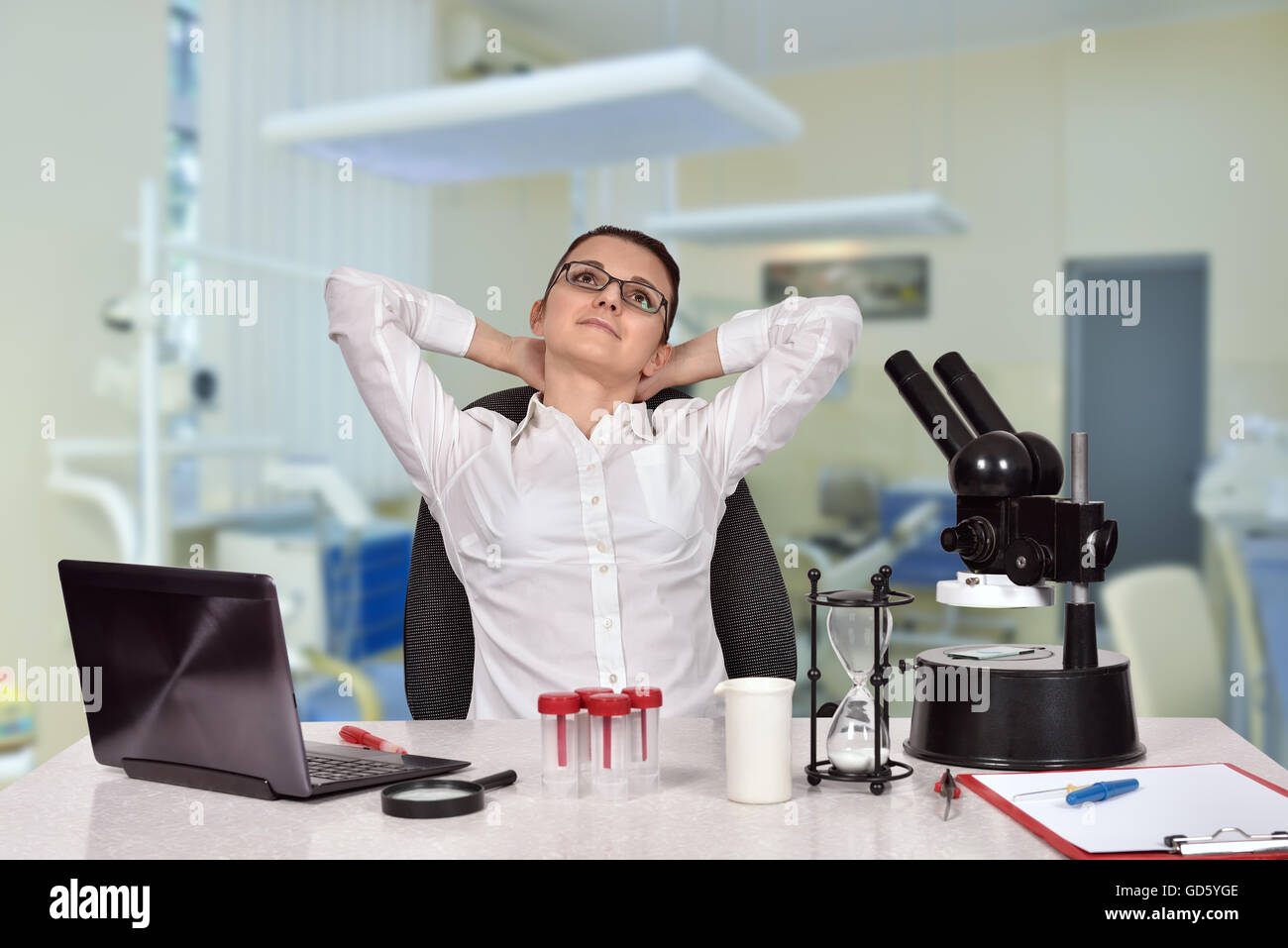 young female scientist thinking sitting in laboratory Stock Photo - Alamy