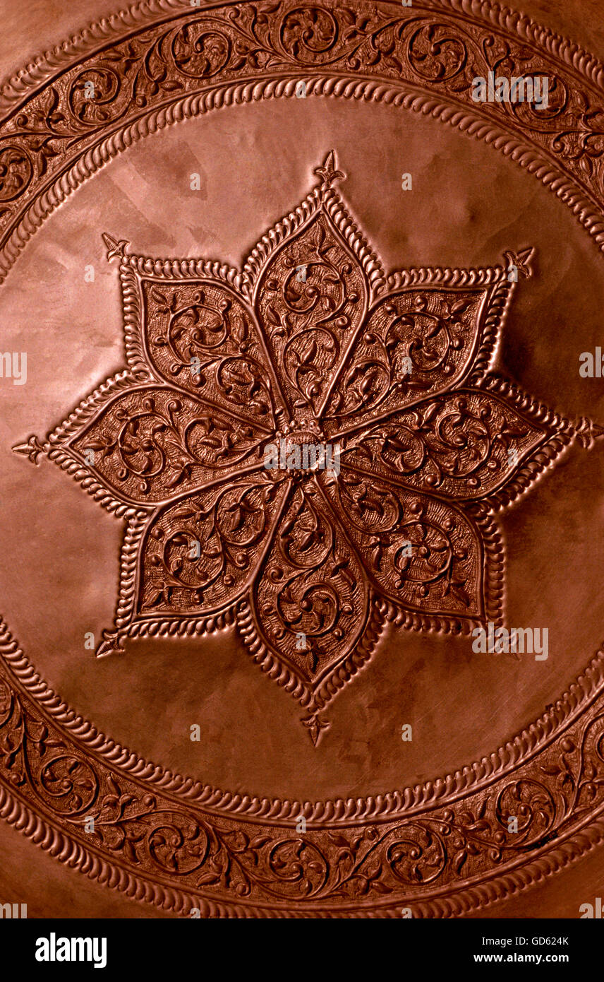 Detail of carved copper tray Stock Photo - Alamy